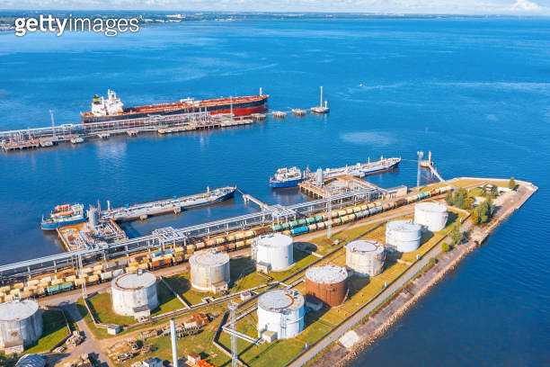 Aerial view large port oil loading terminal with large storage tanks ...