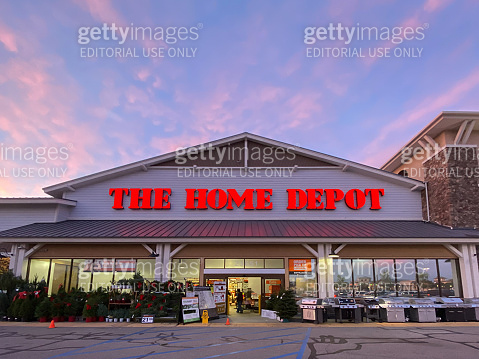 The Home Depot store entrance with colorful sunset in the background in ...