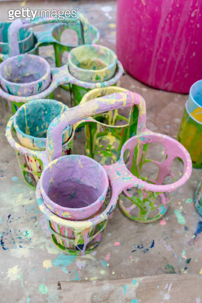 Poster color and plastic palette with colorful paints on recycle paper ...