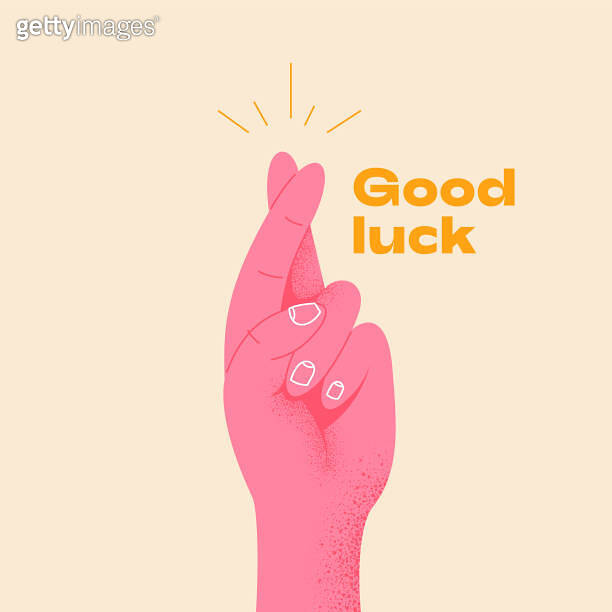 Pink hand crossing fingers and wishing for good luck. Fingers crossed ...