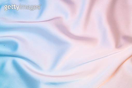 Silk shiny fabric texture in pastel iridescent holographic colors ...
