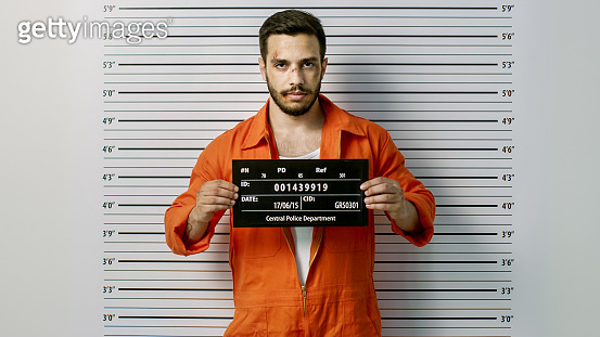 In a Police Station Arrested Man Getting Front-View Mug Shot. He's ...