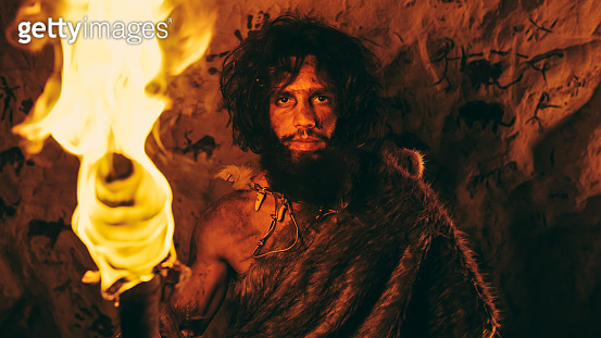 Portrait of Primeval Caveman Wearing Animal Skin Standing in His Cave ...