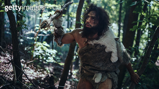 Close-up Portrait of Primeval Caveman Wearing Animal Skin and Fur ...