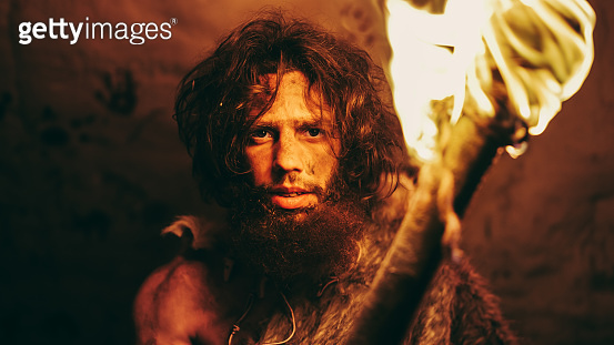 Portrait of Primeval Caveman Wearing Animal Skin Standing in His Cave ...