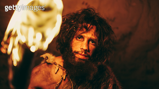 Portrait of Primeval Caveman Wearing Animal Skin Standing in His Cave ...