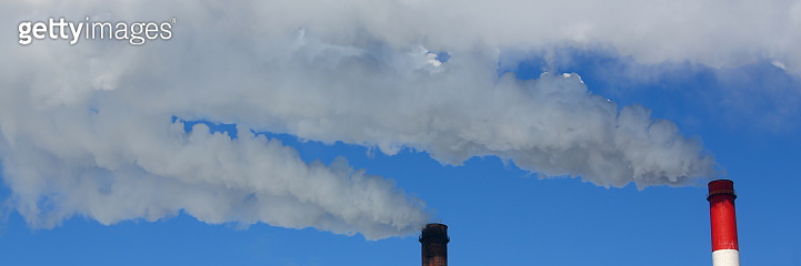 White smoke comes from pipes against blue sky 이미지 (1134033370) - 게티이미지뱅크