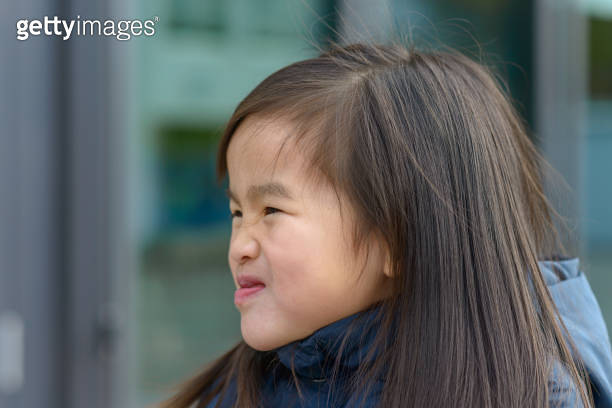 Young asian girl with disgust face side portrait 이미지 (1189475891) - 게티이미지뱅크