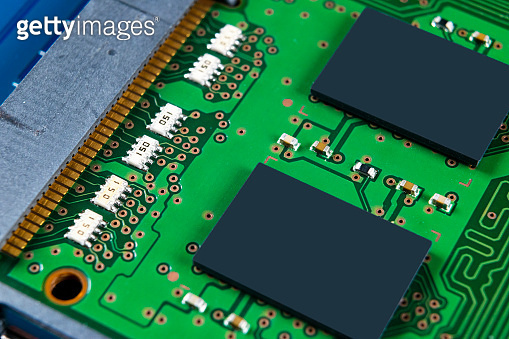 Macro shot of Circuit board with resistors microchips and electronic ...