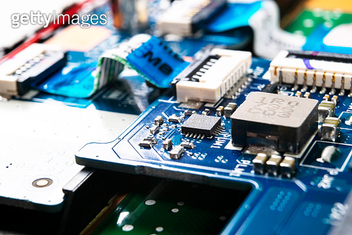 Macro shot of Circuit board with resistors microchips and electronic ...