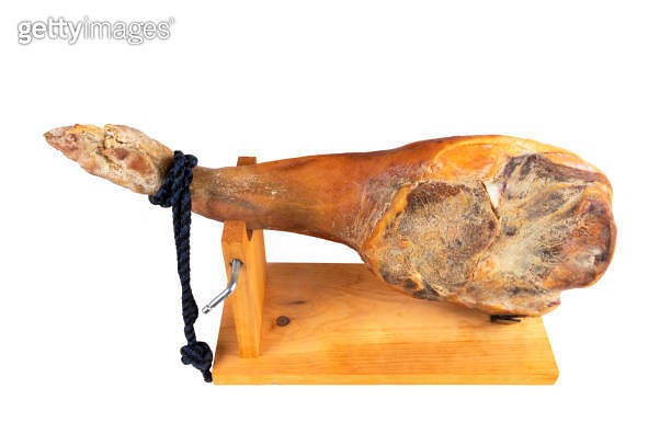 Jamon serrano. A Spanish ham isolated on white background. Traditional ...