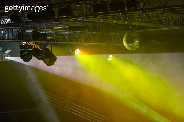 Stage lights. Soffits. Concert light. Silver mirror disco ball in the ...