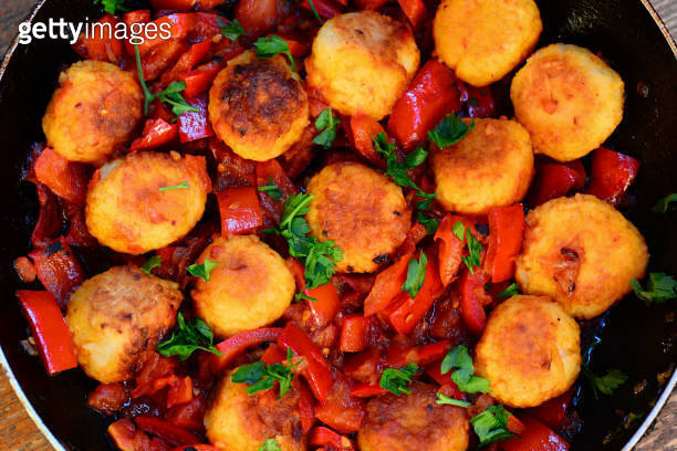 Fried rice balls with vegetables. Homemade fried rice balls with stewed ...