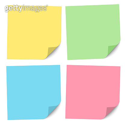 Set of note papers of different colors with a bent right bottom corner ...