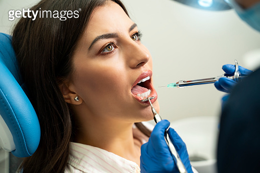 beautiful young adult woman getting dental anesthesia (1173011135) - 게티 ...