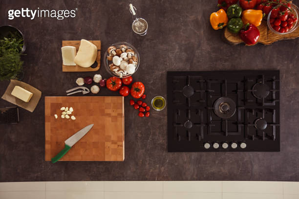 Flat lay of ingredients ready to be made into a meal lying on a kitchen ...