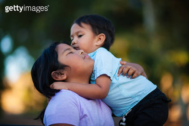Siblings hug and embrace each other showing love, and affection ...