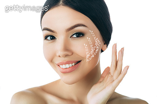 portrait of asian woman with perfect skin of the face, with arrows on ...