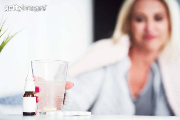 Adult woman feeling unewll and taking tablets at home 이미지 (1171493754 ...