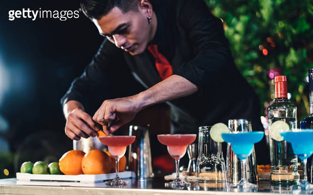 Professional asian male bartender prepare mixing cocktail drink at ...