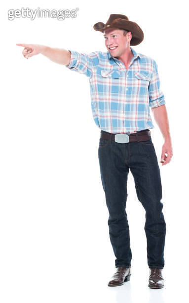 Handsome cowboy is pointing forward (1134498494) - 게티이미지뱅크