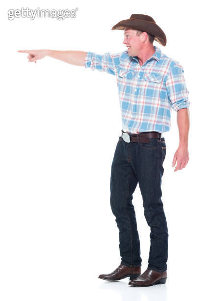 Handsome cowboy is pointing forward (1134498524) - 게티이미지뱅크