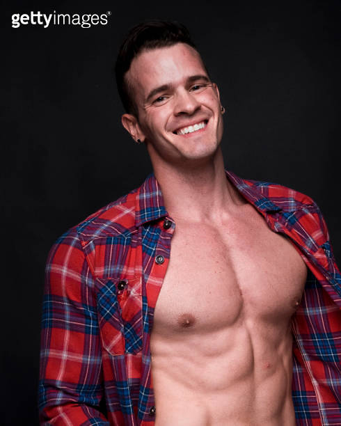 Sexy man wearing an unbuttoned flannel shirt 이미지 (1168658215) - 게티이미지뱅크