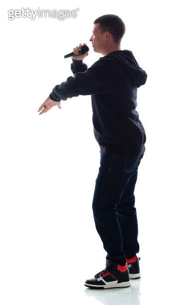 Full length / one man only / one person / side view / profile view of ...