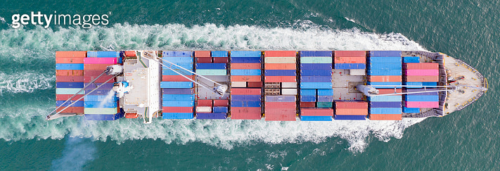 Aerial view and top view. Container ship in pier with crane bridge ...