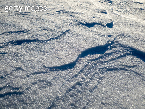 Patterns in the snow after a blizzard. Snow after a blizzard. Snow ...