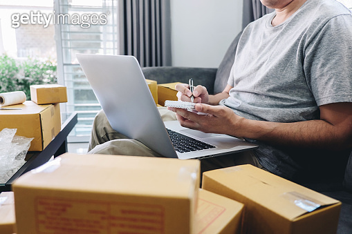 Small business parcel for shipment to client at home, Young ...