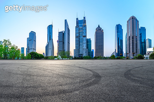 Asphalt race track ground and modern skyline and buildings in Shanghai ...