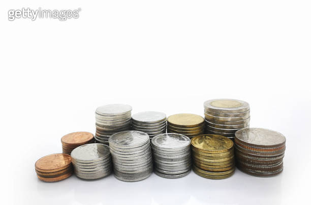 Overlay and stack many coins like graph on white background for ...