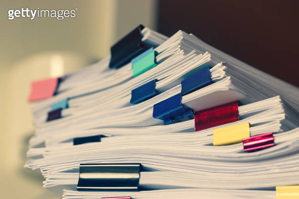 Pile of student homework that assigned to student to be completed ...