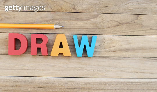 Colorful Word ' DRAW ' on Wooden Table with Orange Pencil Upper a Word ...