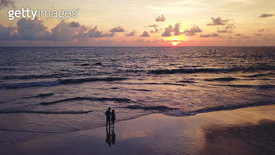 Happy Asian couple dating at the beach during travel honeymoon trip on ...