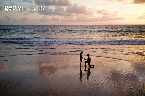 Happy Asian couple dating at the beach during travel honeymoon trip on ...