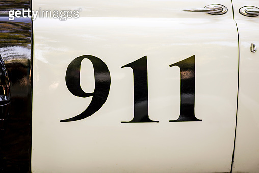 911 text on side of a police car. 911 Emergency response police car ...