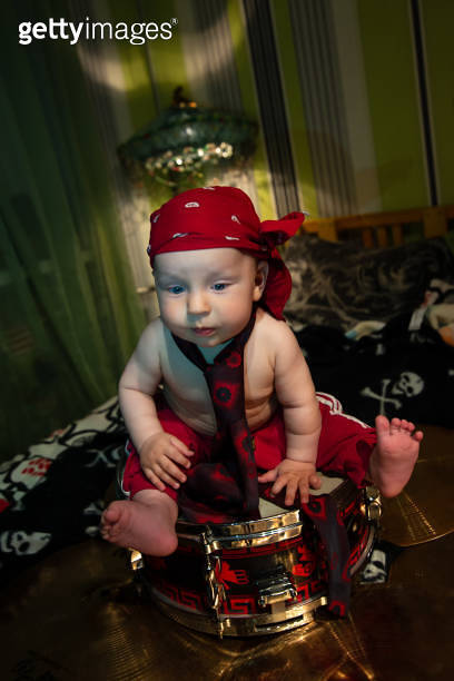 little boy rocker drummer in red bandana and with drum (1129906889 ...