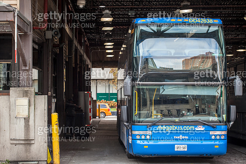 Megabus logo on a motorcoach bus standing in Toronto Coach Station ...