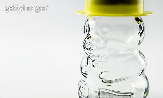 Empty bear shaped cute clear glass jar. Great honey gift idea concept ...