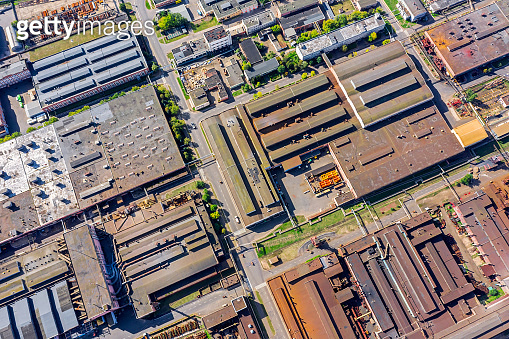city industrial zone with factories, rows of warehouses and storages ...