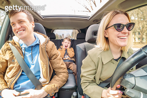 young family with little boy kid inside car. road trip concept ...