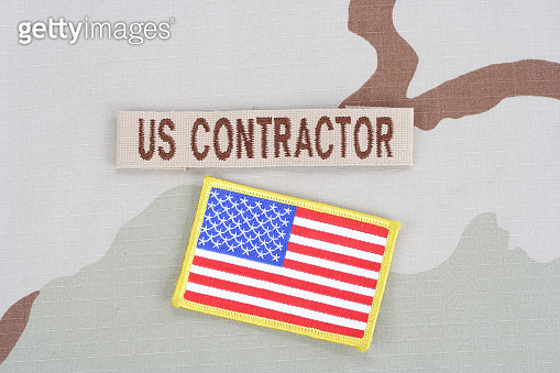 US CONTRACTOR branch tape and flag patch on desert camouflage uniform ...