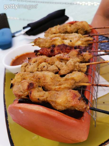 Delicious closeup with delicious chicken satay dining outside ...