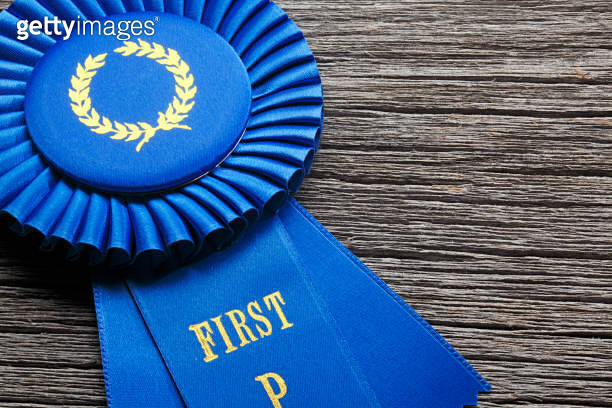 Blue Ribbon On Plank Of Old Weathered Wood (1127157512) - 게티이미지뱅크