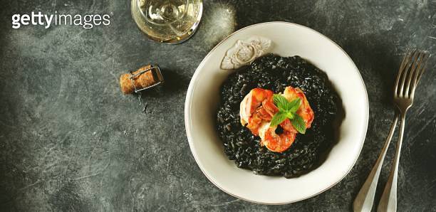 Delicious Italian risotto with grilled big tails of shrimp and ...