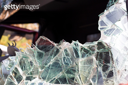 Broken front window of car in traffic accident. After the car crash ...