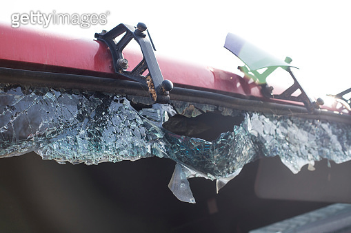 Broken front window of car in traffic accident. After the car crash ...
