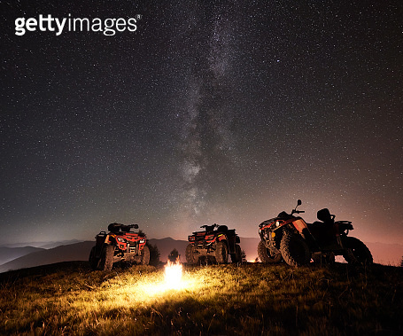 Atv quad motorbikes in the mountains under night starry sky (1133634187 ...